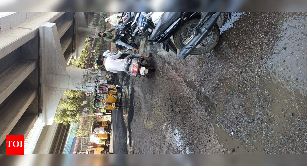 Water & Path Holes on Road - Times of India