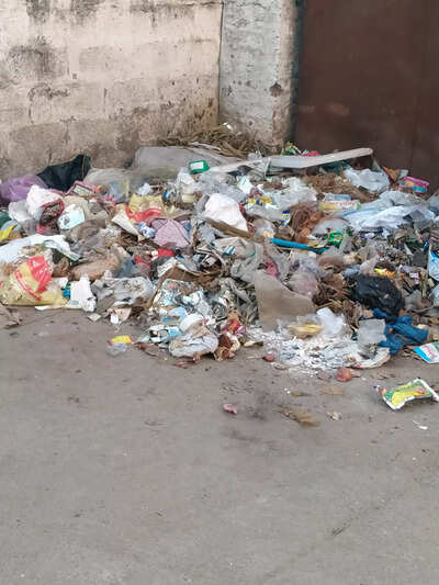 accumulation of garbage near temple & mosque - Times of India
