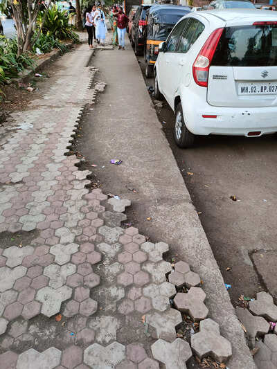 broken foothpath - Times of India