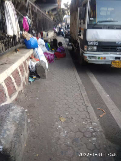 Living Dangerously on Footpath - Times of India