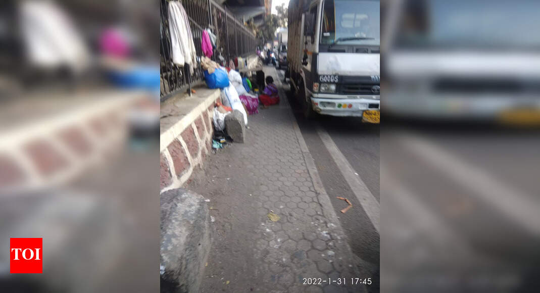 Living Dangerously on Footpath - Times of India