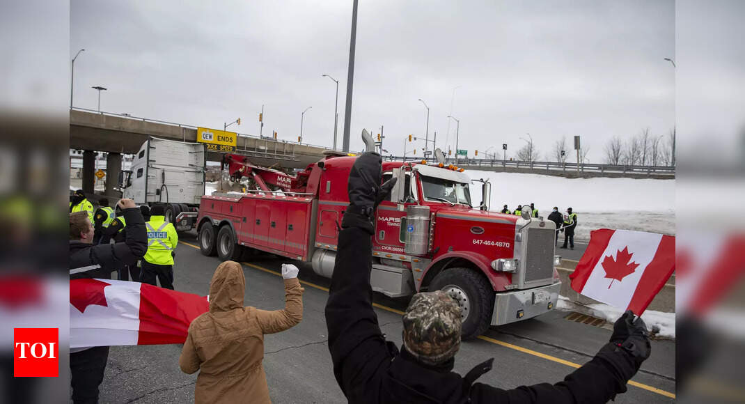 Canada police in standoff with protesters blocking bridge to US - Times ...