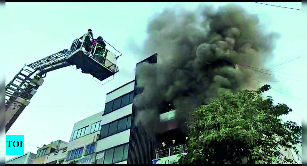 20 Students Rescued From Flaming Library | Surat News - Times of India