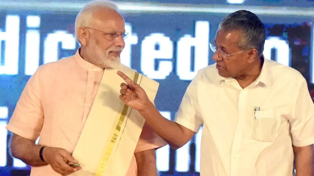In pics: PM Modi 'charms' CM Pinarayi Vijayan | The Times of India