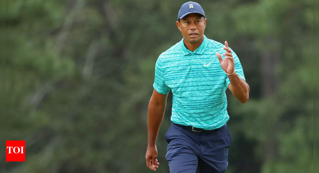 Tiger Woods fights back to make cut on tough day, Scheffler leads at ...