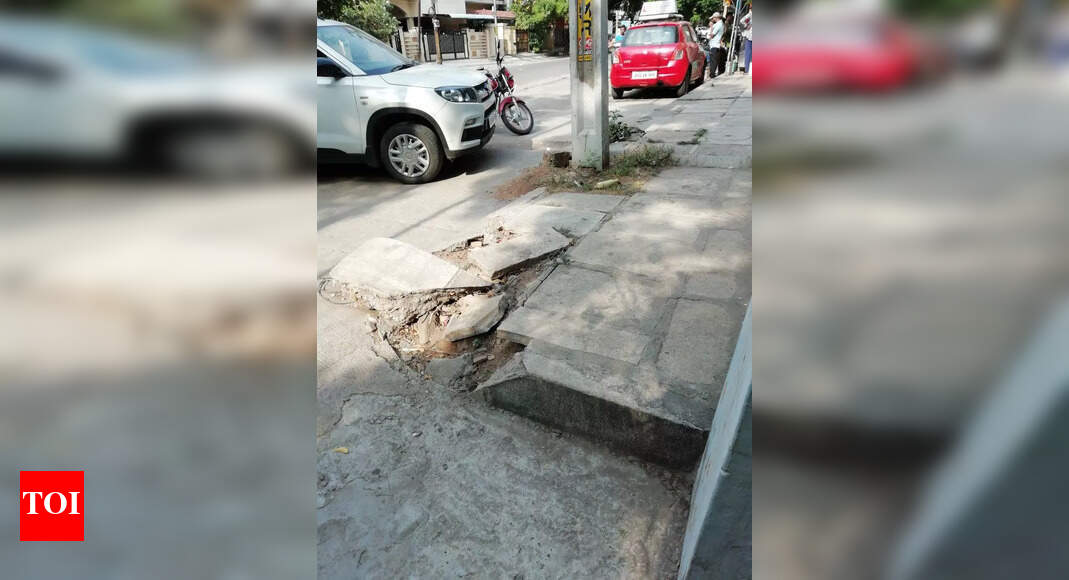 Footpath in Bad shape, Old Electric pole dumped - Times of India
