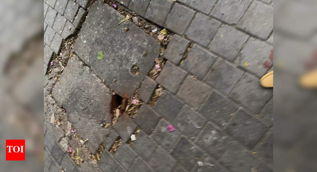 Footpath potholes and garbage @ Colaba Wodehouse - Times of India