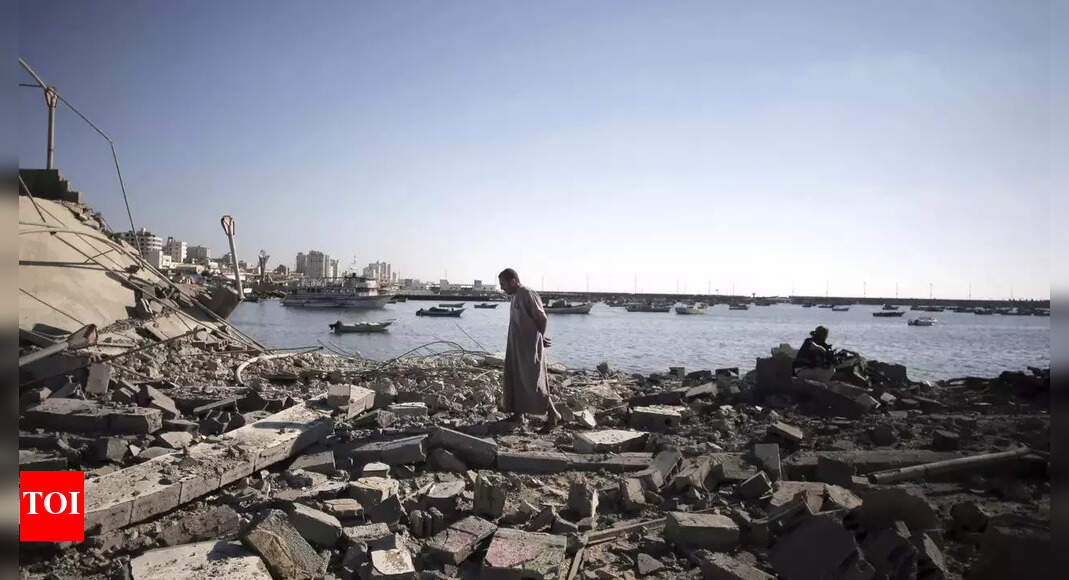 Gaza: Palestinian rocket fire draws Israeli air strikes in Gaza - Times ...