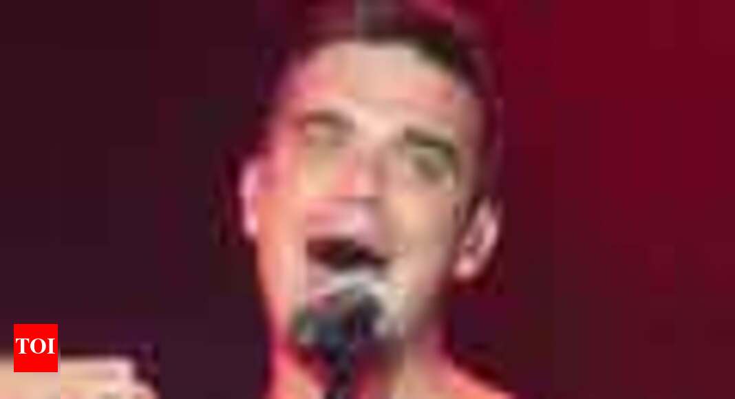 Robbie Williams loses pounds to food poisoning | Hindi Movie News ...