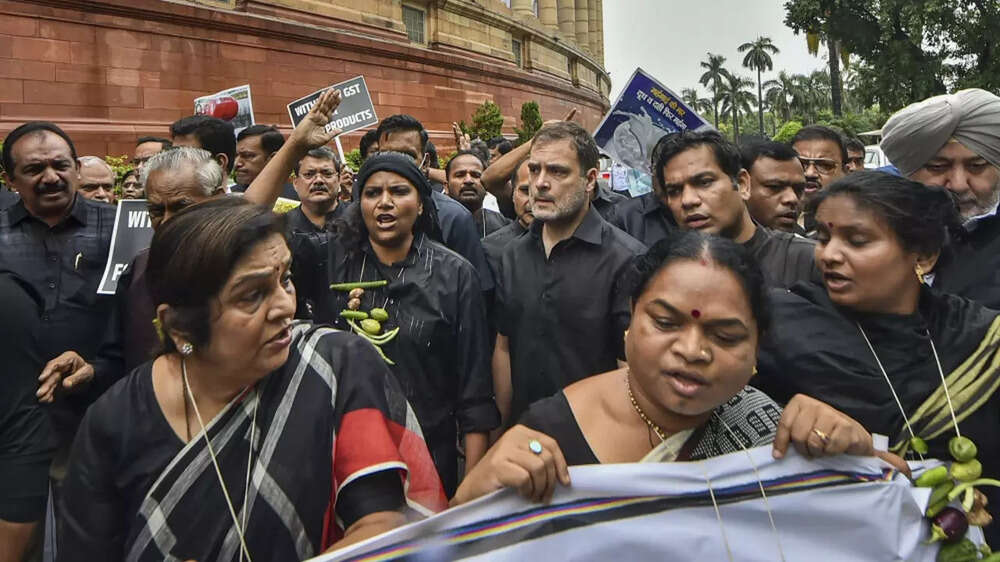 In pics: Congress MPs stage protest in Parliament against price rise ...