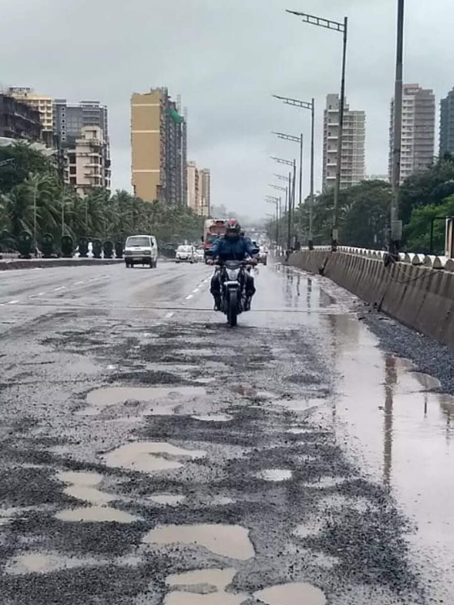 Potholes march on, invade Mumbai flyover | Times of India