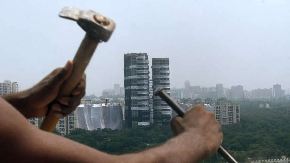 In pics: Noida twin towers' reduced to dust cloud | The Times of India