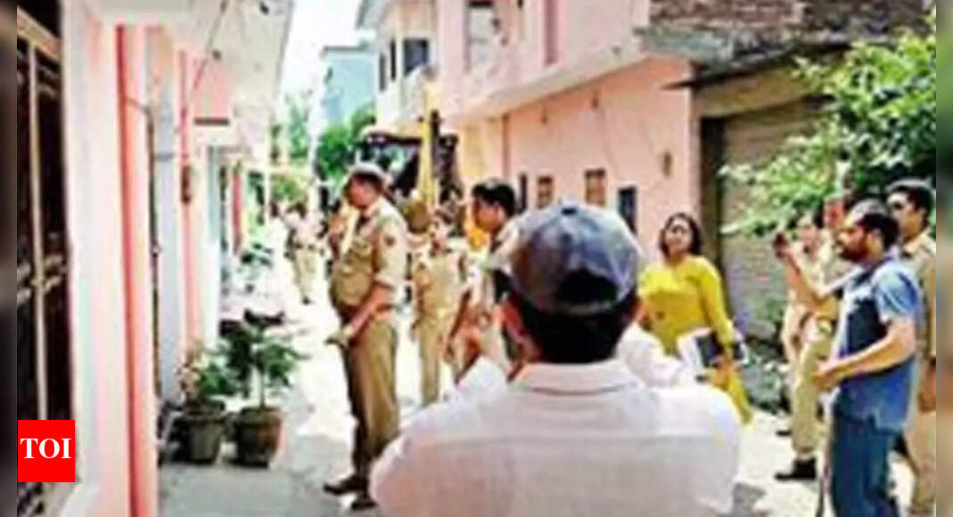 UP cops bring bulldozer to help woman enter in-laws' house | Meerut ...