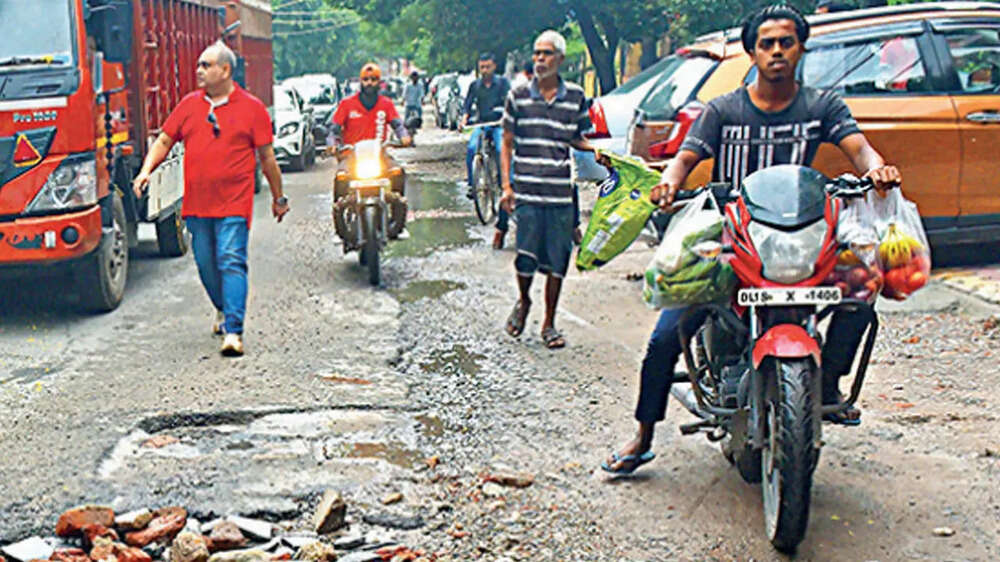 In pics: Delhi pothole menace continues to distress commuters | The ...