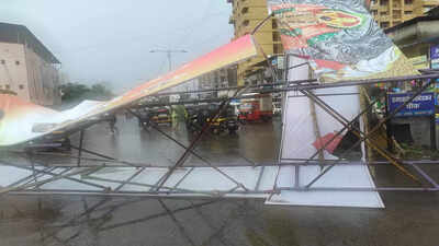 Car damaged as two hoarding frames of Navratri festival collapse in Kalyan | Thane News - Times ...