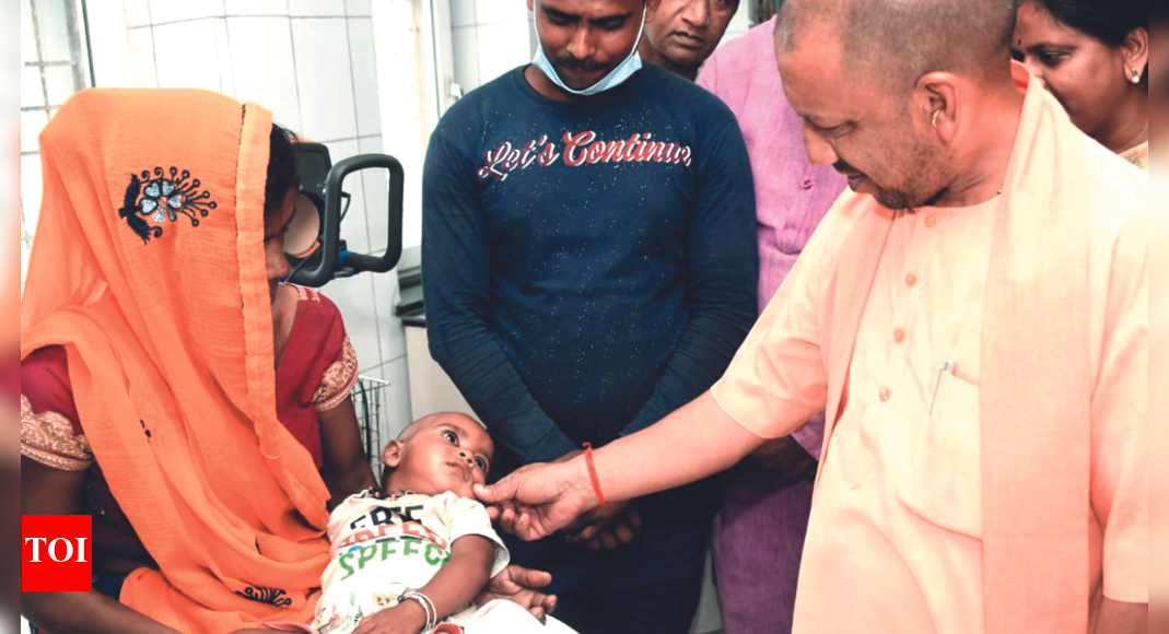 Yogi Adityanath: Cm Yogi Pats Child’s Cheek Crying In Her Mother’s Lap ...