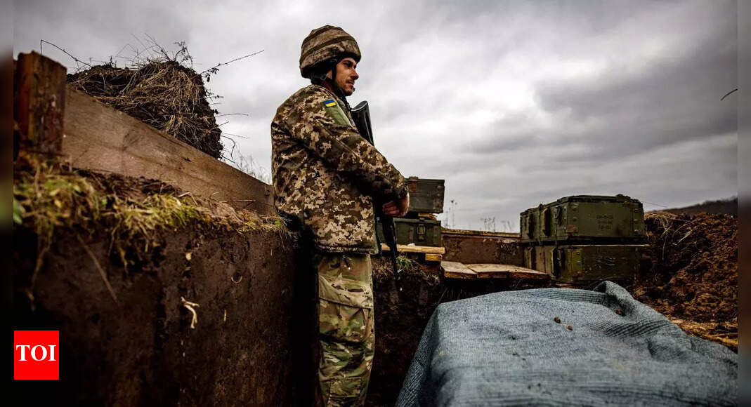 Ukrainian soldiers keep watch at recaptured border - Times of India
