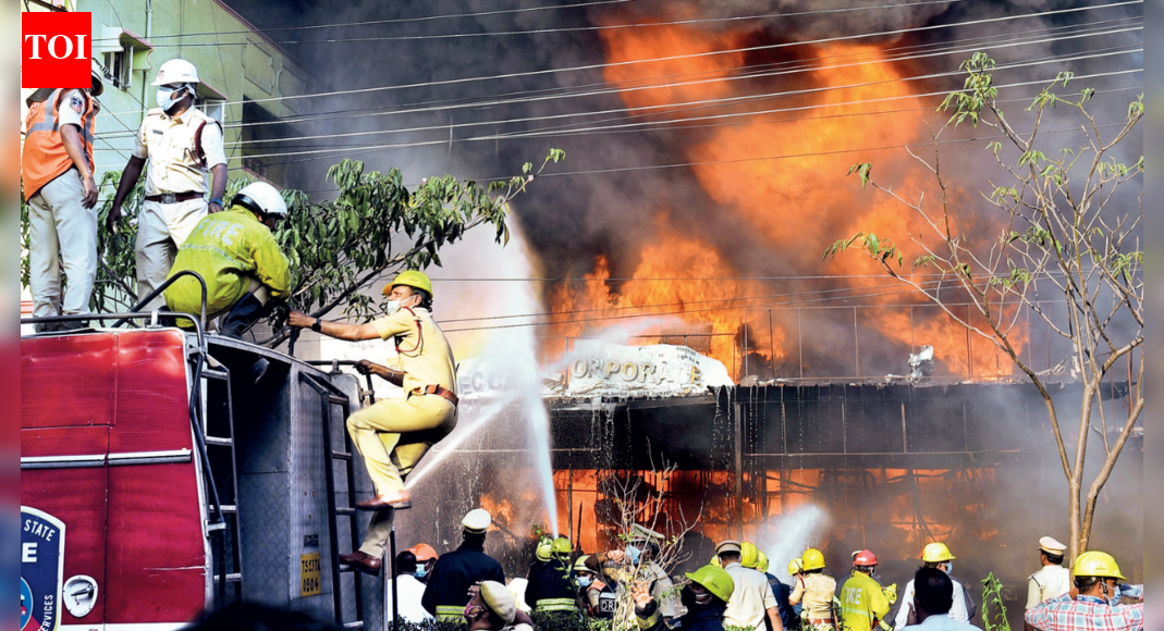 Panic rages as burning building wobbles, can collapse any time in ...
