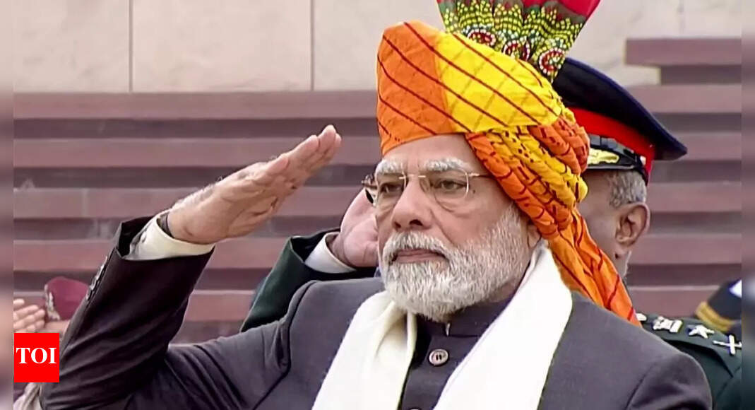Rajasthani: PM Modi wears multicolour Rajasthani turban symbolising ...