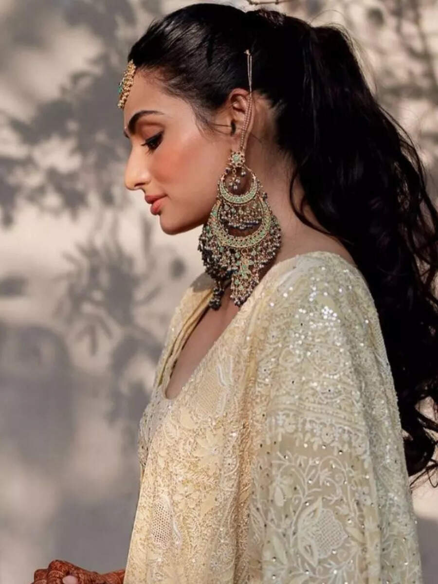 New bride Athiya Shetty ditches bling for chikankari lehenga for ...