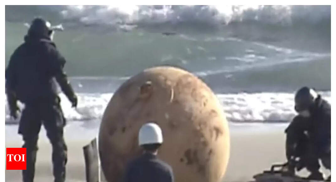 Large mysterious metal ball lands up at a beach in Japan - Times of India
