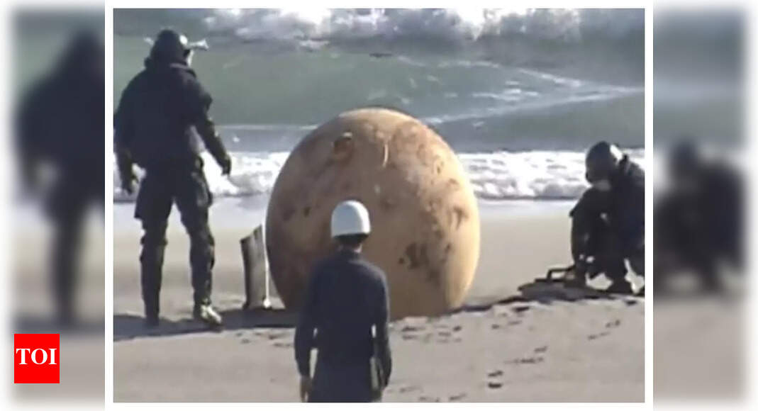 Large mysterious metal ball lands up at a beach in Japan - Times of India