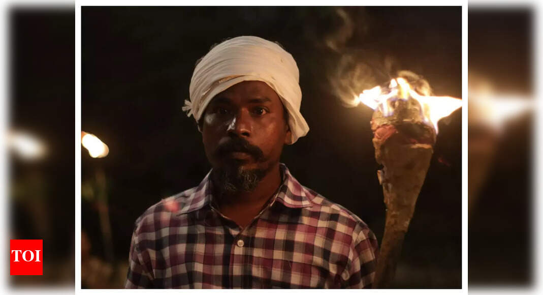 Kannada author and theatre artist Mahadeva Hadapada plays a character ...