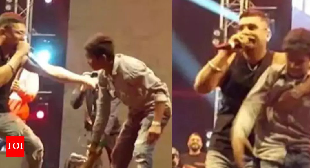 Yo Yo Honey Singh dances heart out with stage helper during a concert ...