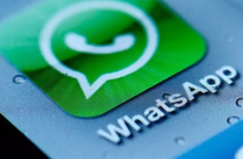 How do I start voice typing on WhatsApp?
